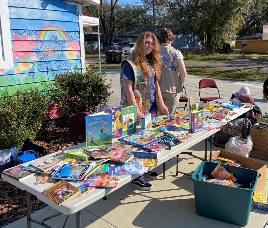 Local Girl Scout donates books for literacy - WMNF 88.5 FM