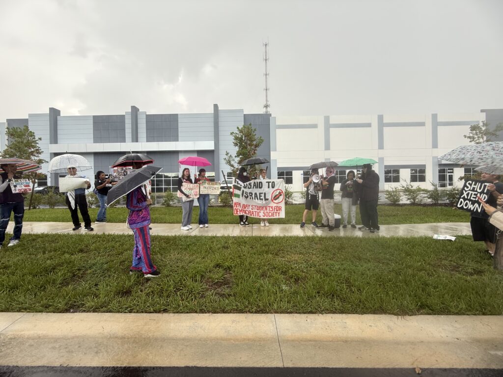 Students for a Democratic Society protests outside XTEND factory in ...