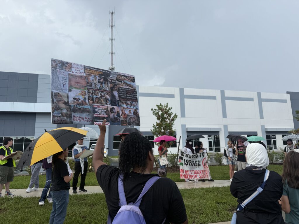 Students for a Democratic Society protests outside XTEND factory in ...