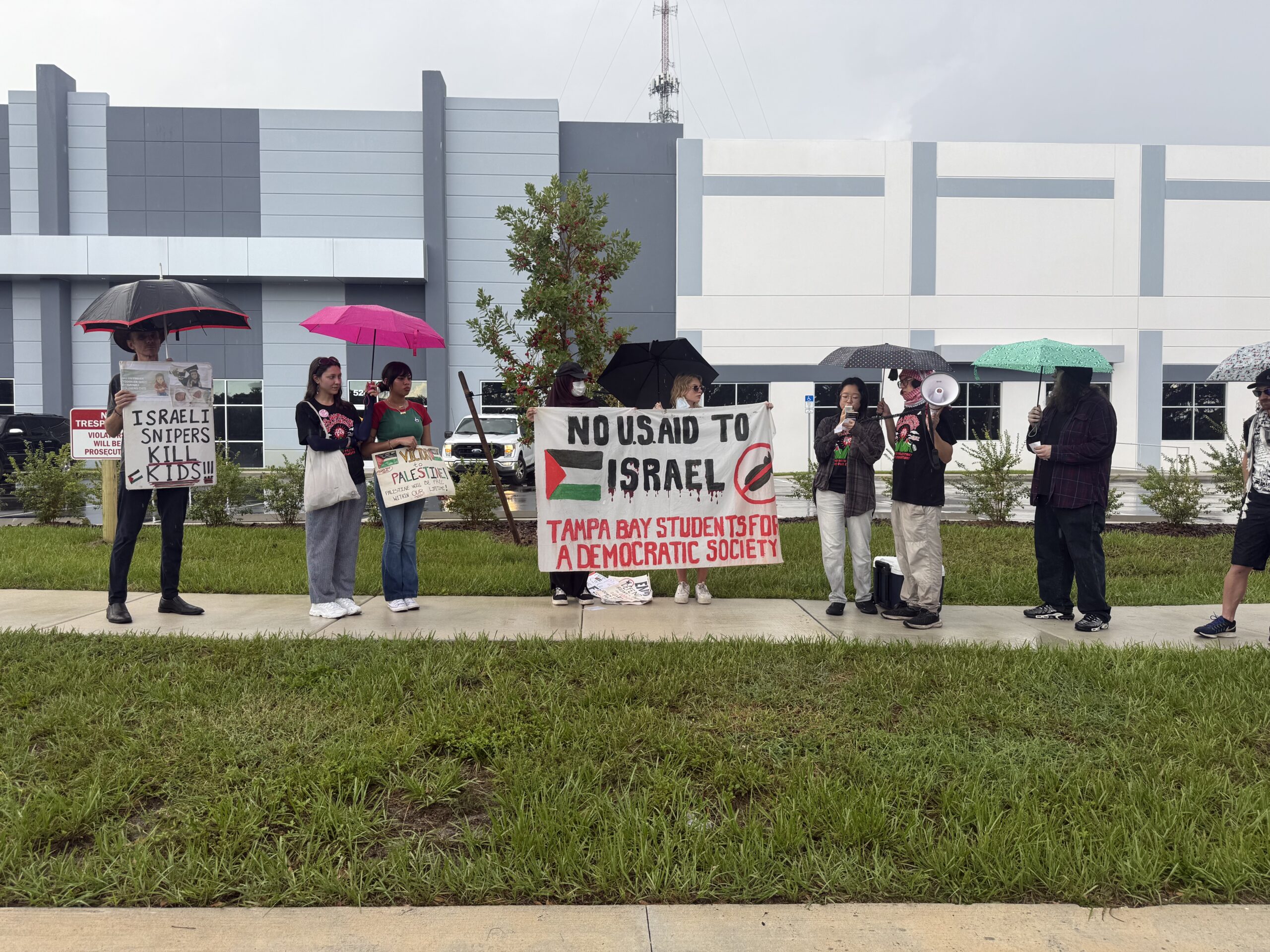 Students for a Democratic Society protests outside XTEND factory in ...
